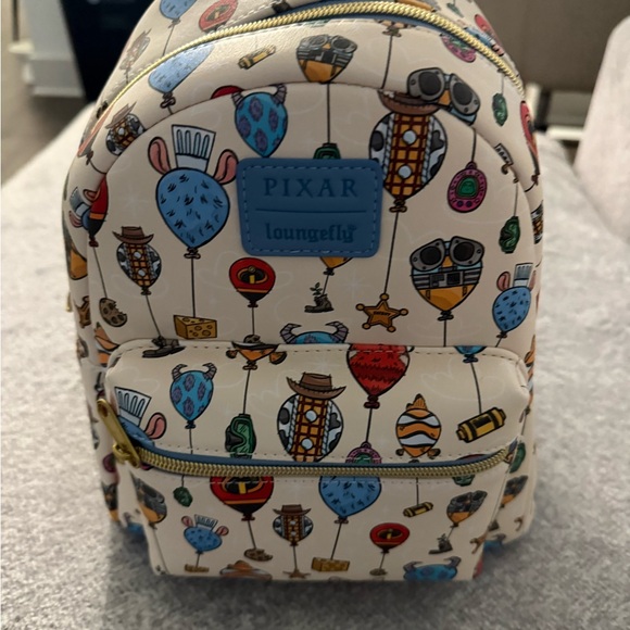 Loungefly | Bags | Disney Pixar Loungefly Cream Backpack With Whimsical ...